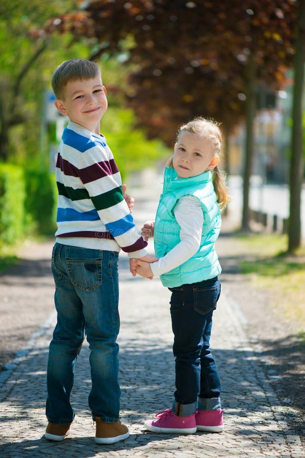 Two Happy Children Walking in Park Stock Image - Image of outdoor ...