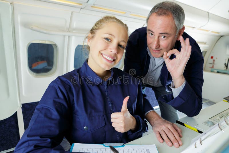 Two Happy Co-workers Showing Ok Sign Stock Photo - Image of privatejet ...