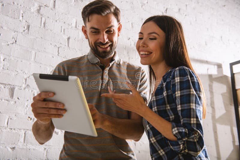 Two Happy Colleagues Work with a Tablet in Office Stock Photo - Image ...