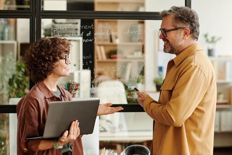 Two Happy Employees Discussing Working Points by Transparent Board ...