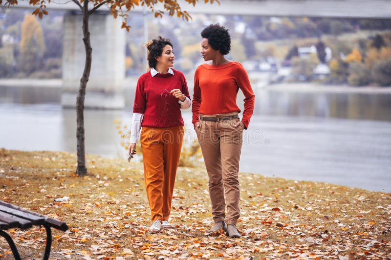 Happy Female Friends Walking Outside Stock Image - Image of city, river ...