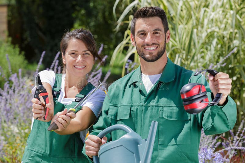 Two Happy Gardeners at Work Stock Image - Image of store, plantation ...