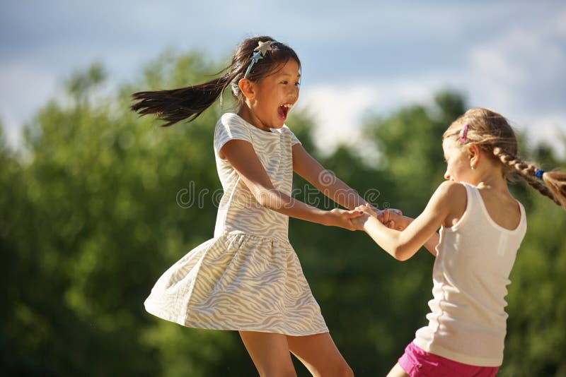 Two Happy Girls Dancing in a Circle Stock Photo - Image of dance ...