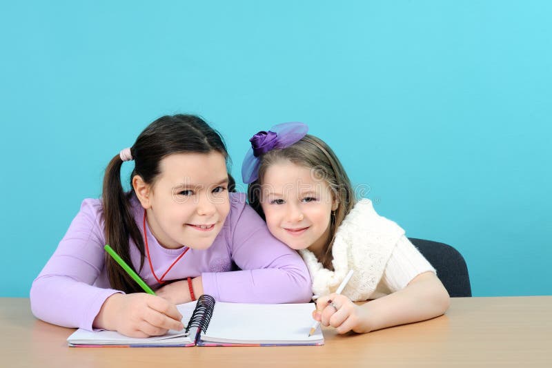 Three Happy Girls Doing Their School Work Stock Photo - Image of group ...