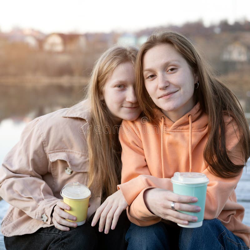 Two Happy Girls Drinking Coffee Stock Photo - Image of model, happy ...
