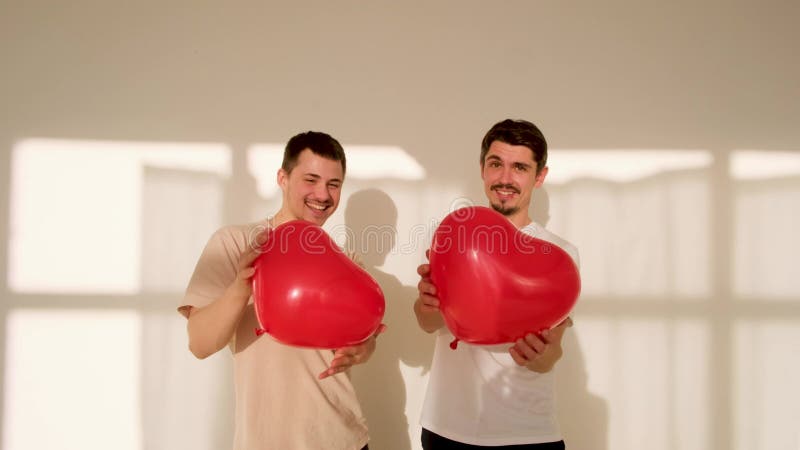 Two happy guys are dancing stock video. Video of heart - 204139663