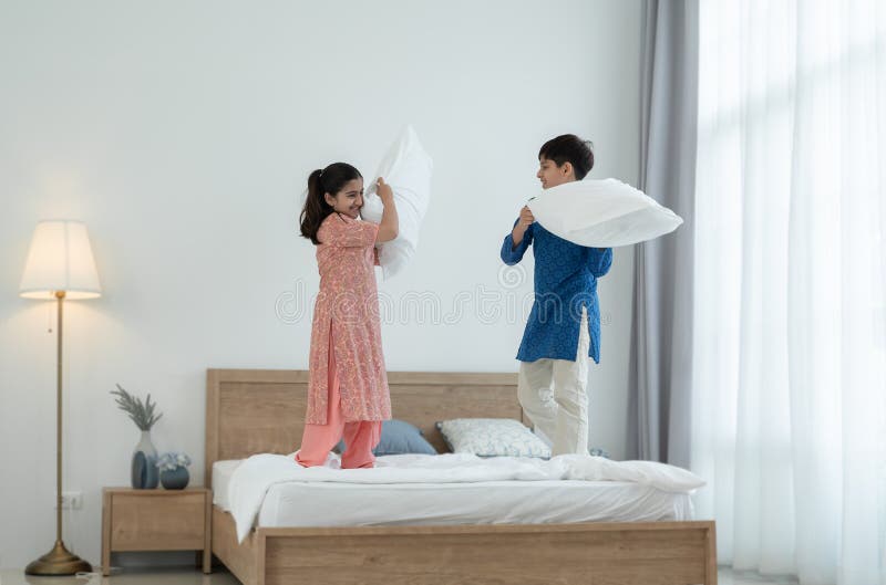 Two Happy Indian Brother And Sister In Traditional Clothing Standing On