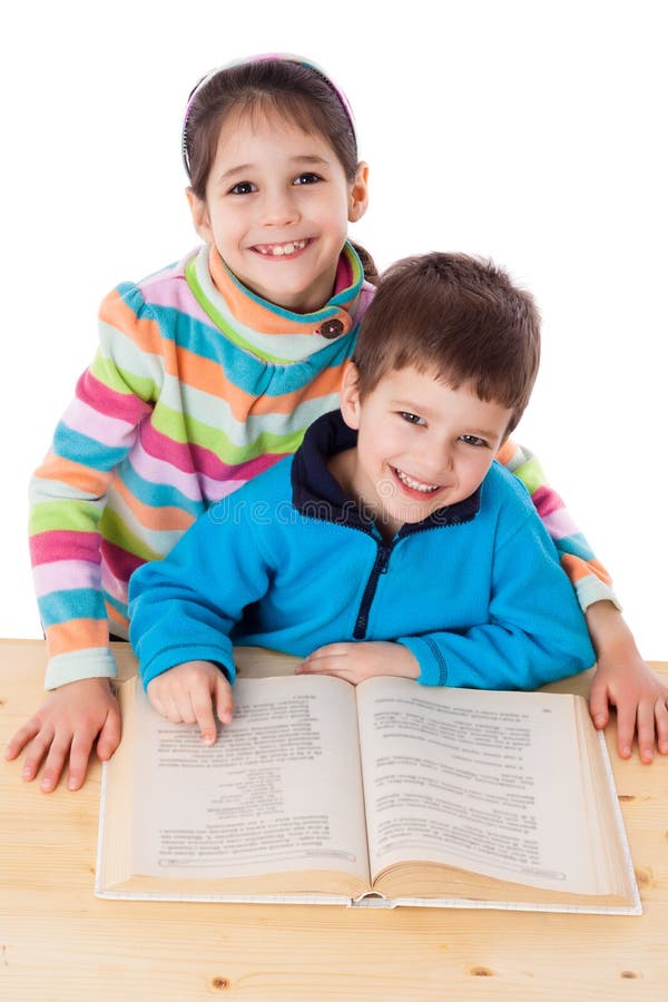 Two Happy Kids Reading the Book at the Table Stock Image - Image of ...