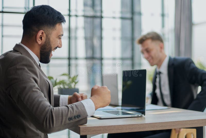 Two Happy Men Working Together on a New Business Project Stock Image ...