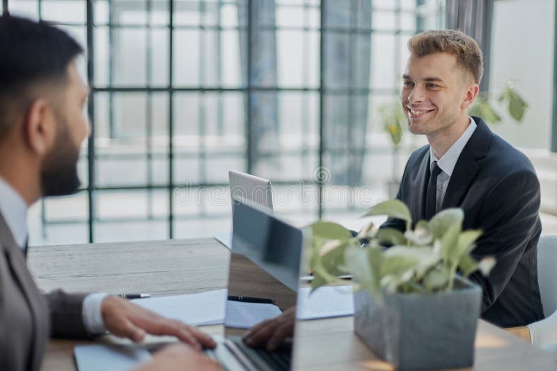 Two Happy Men Working Together on a New Business Project Stock Image ...