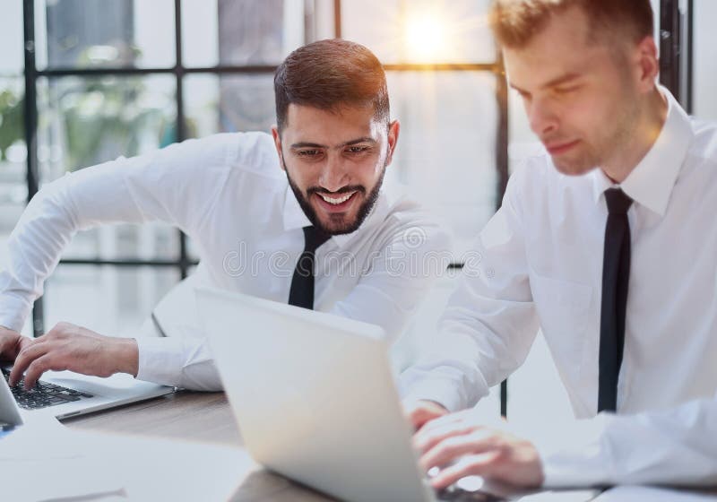 Two Happy Men Working Together on a New Business Project Stock Photo ...