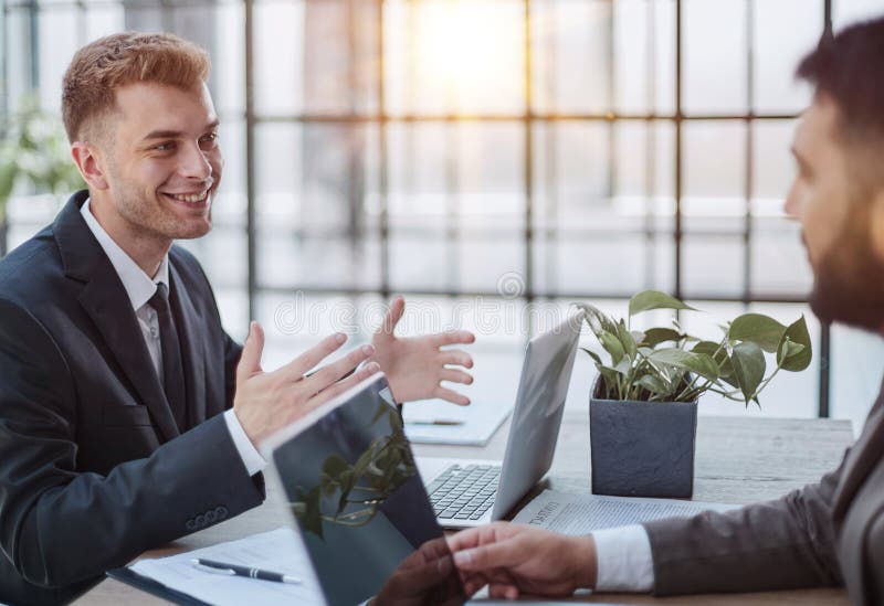Two Happy Men Working Together on a New Business Project Stock Image ...