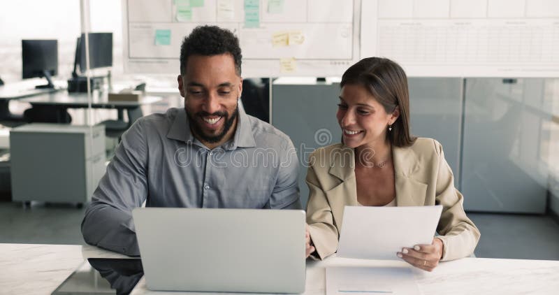 Two Happy Multiethnic Project Managers Working at Laptop Together Stock ...