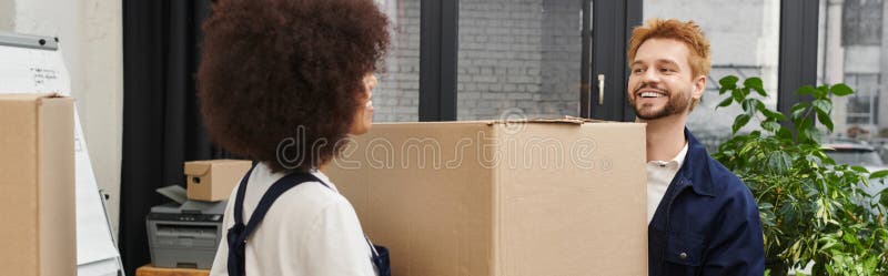 Smiling Individuals Engage in Packing and Stock Photo - Image of ...