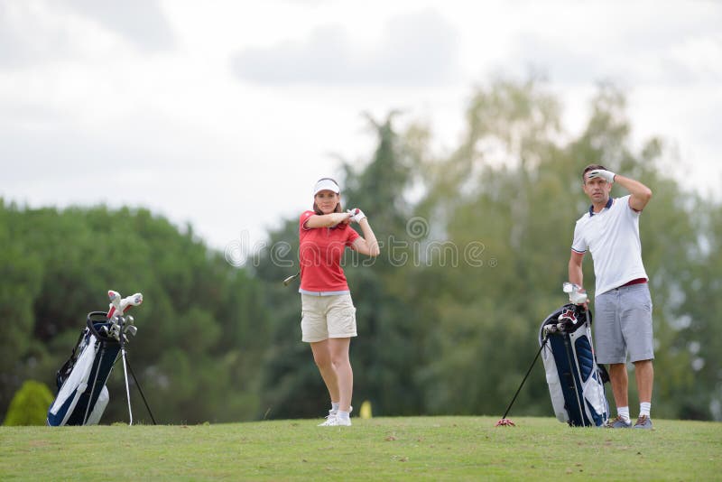 Two Happy People Playing Golf Stock Photo - Image of competition, trees ...