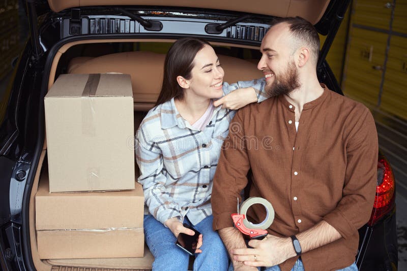Two Happy People Sitting in the Trunk of a Car Stock Image - Image of ... Two Happy People Sitting in the Trunk of a Car Stock Image - Image of ...
