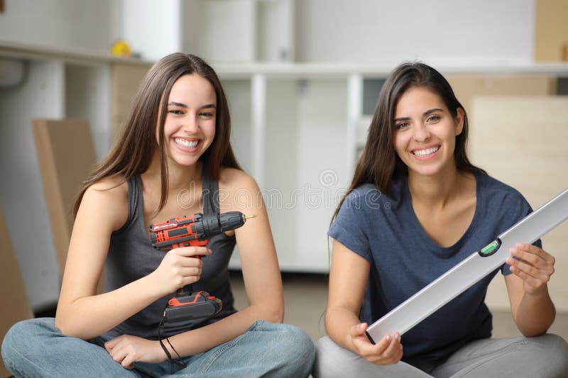 Two Happy Roommates Reforming House Posing Stock Image - Image of ...