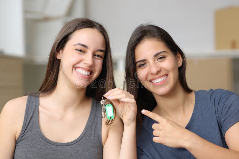 Two Happy Roommates Showing Keys Moving House Stock Image - Image of ...