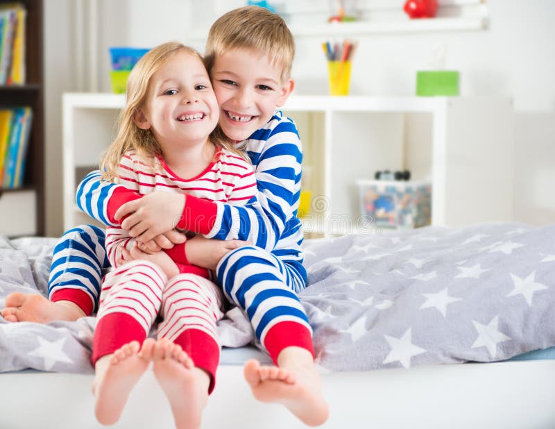 Two Happy Siblings in Sleepwears in Bed Stock Image - Image of blanket ...
