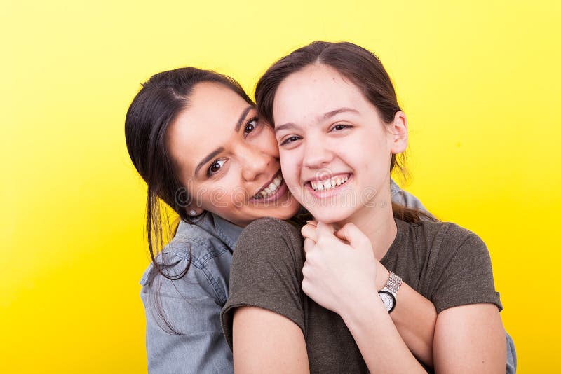 Two happy sisters laughing stock image. Image of friendship - 115213413
