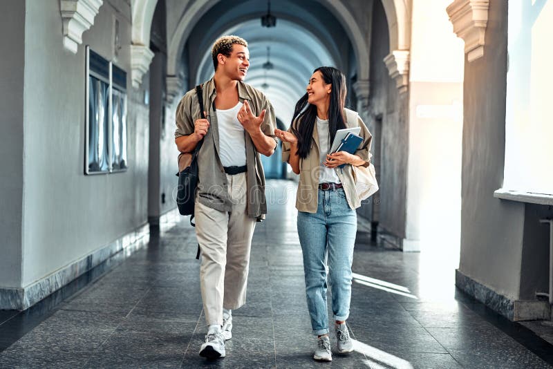 Two Happy Stylish Modern Students are Walking Down the University ...