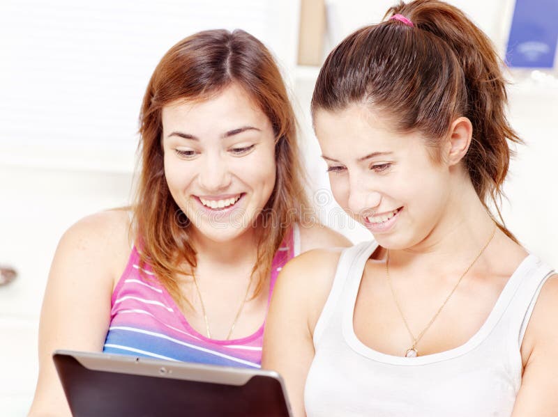 Two Happy Teenage Girls Using Touchpad Computer Stock Photo - Image of ...