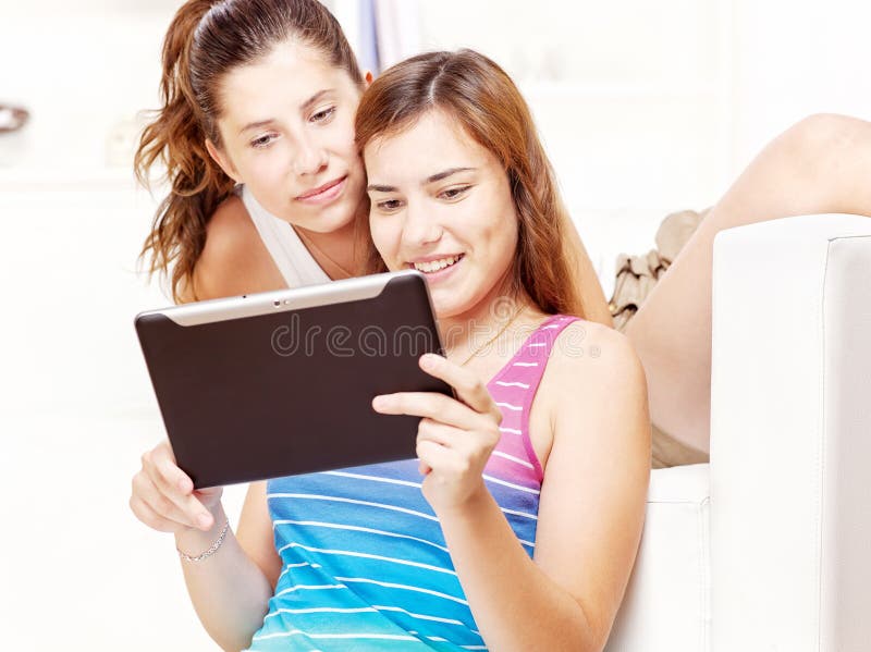 Two Happy Teenage Girls Using Touchpad Computer Stock Photo - Image of ...