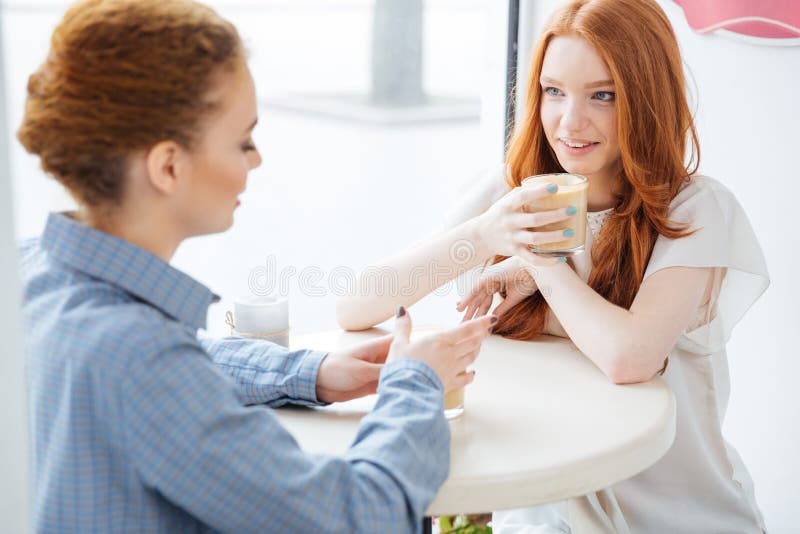 Two Happy Women Talking and Drinking Coffee in Cafe Stock Photo - Image ...