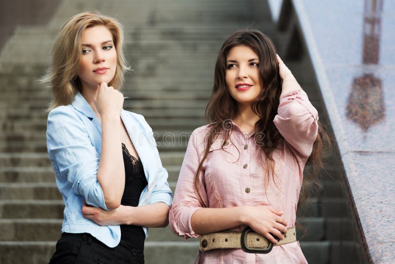 Two Happy Young Women on the Steps Stock Photo - Image of beautiful ...