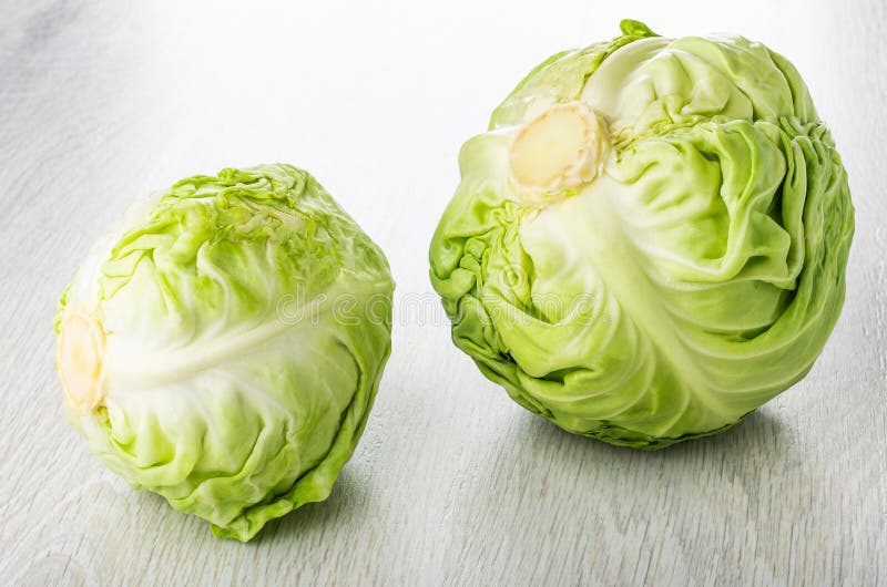 Two Heads of Cabbage on Wooden Table Stock Photo - Image of close ...