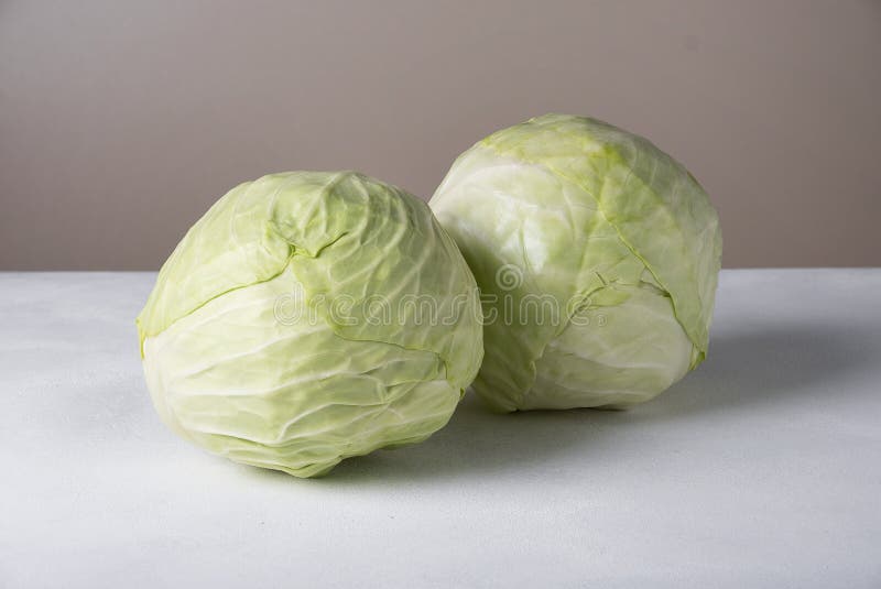 Two Heads of White Cabbage Lie on the Surface Stock Photo - Image of ...