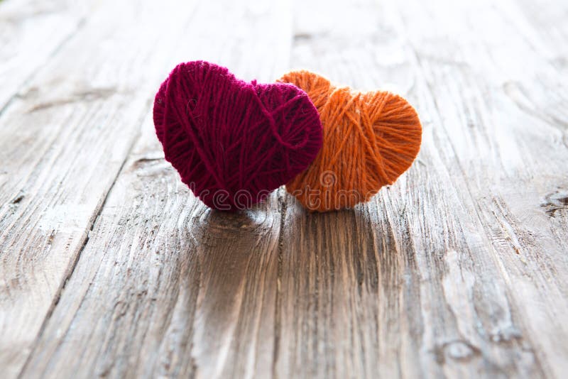 Two Heart Shape Of Yarn On Vintage Wooden Background Stock Photo ...