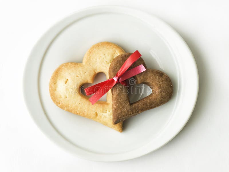 Two Heart-shaped Cookies Tied Together Stock Photo - Image of saucer ...