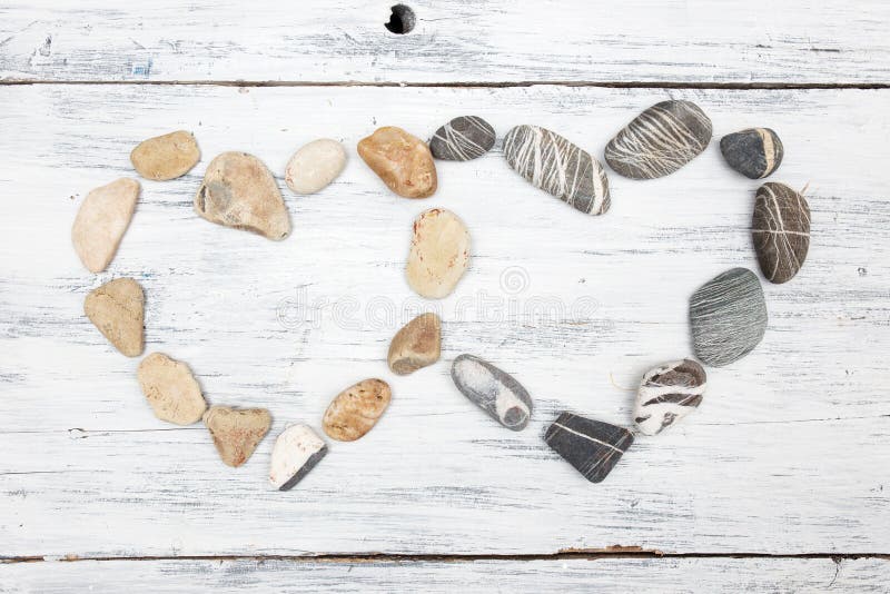 Two Heart Shaped Pebble Stones on a Old Wood Stock Photo - Image of ...