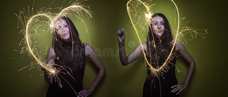 Girl is Drawing Three Hearts Stock Photo - Image of studio, spark: 39065682