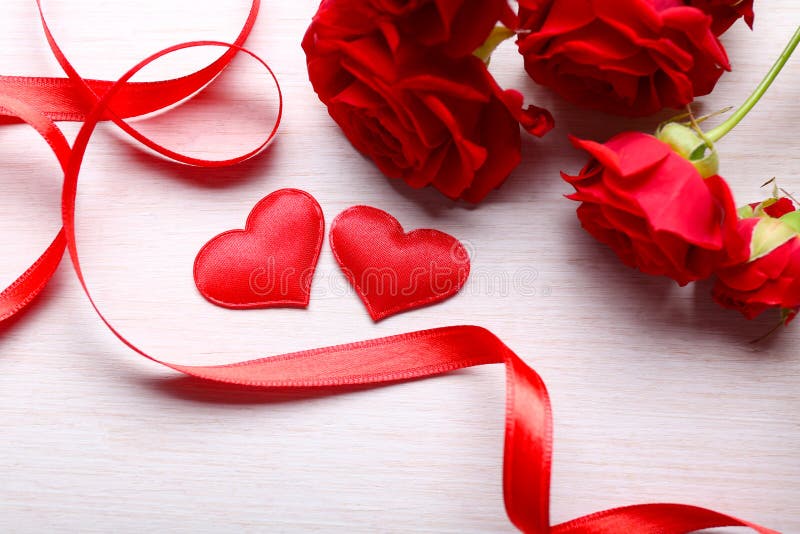 Two Hearts, Ribbon and Red Roses on Table Stock Photo - Image of ...