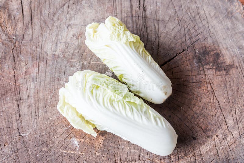 Two Hearts of Romaine Lettuce on a Rustic Wooden Board Stock Photo ...