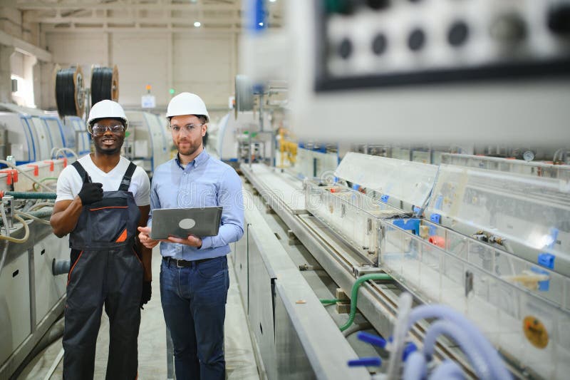 Two Heavy Industry Engineers Stand in Factory Stock Image - Image of ...
