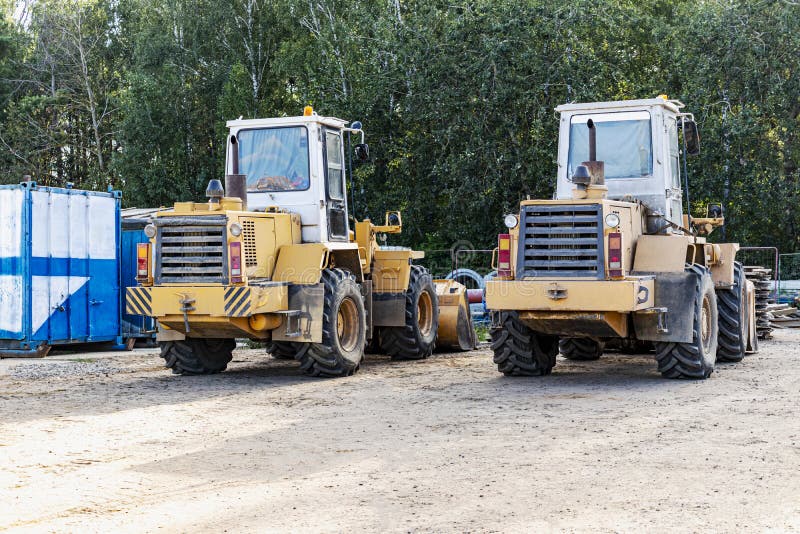 Two Heavy Wheel Loaders are Standing at a Construction Site. Equipment ...