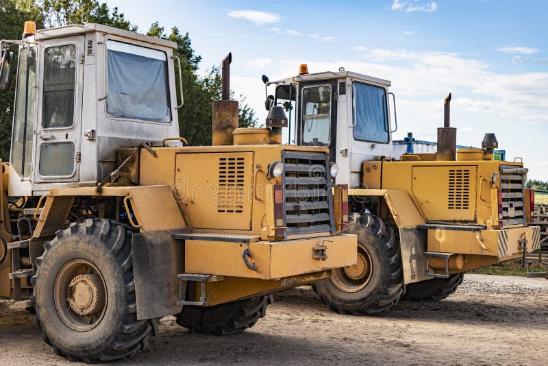 Two Heavy Wheel Loaders are Standing at a Construction Site. Equipment ...