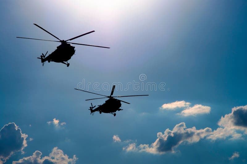 Two helicopters stock photo. Image of cloud, pair, strength - 66450742