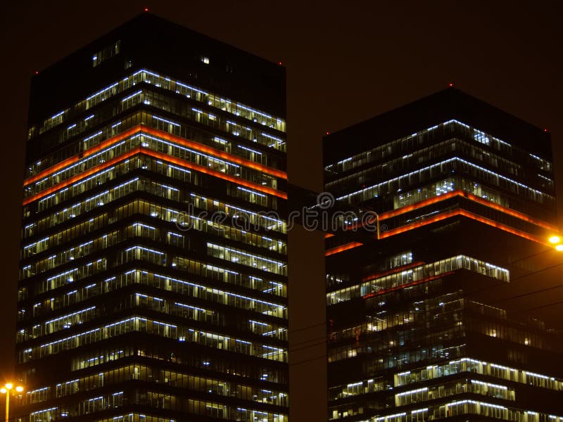 Two High-rise Buildings Connected by a Transition in the Night City ...