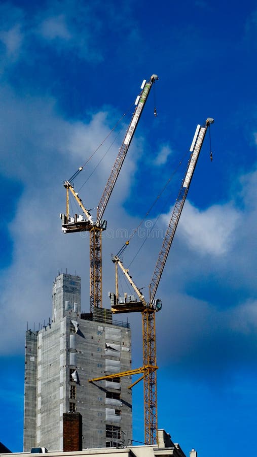 Two High Rise Cranes stock image. Image of building - 173009527