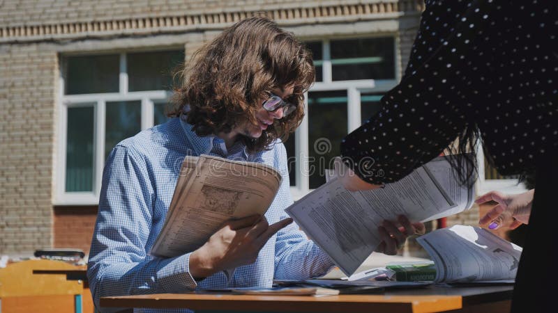 Two High School Students Collaborate on a Project at an Outdoor Table ...