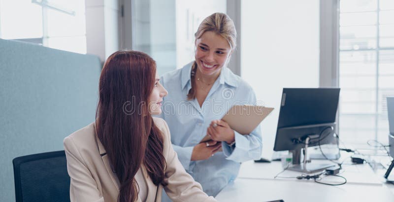 Professional Women Collaborating Effectively in a Modern Office Work ...