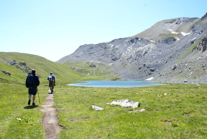 Two Hikers Walking Along a Trail in Roburent, Italy Stock Image - Image ... Two Hikers Walking Along a Trail in Roburent, Italy Stock Image - Image ...