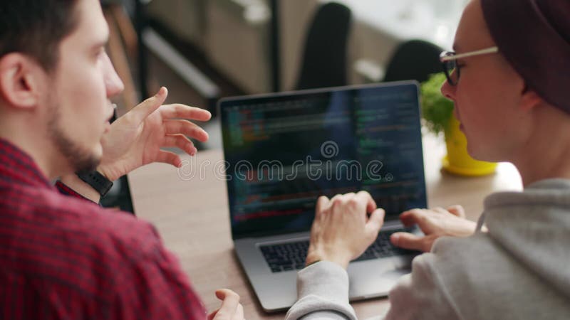 Two Hipster Coworkers Sharing Ideas about Project Sitting with Laptops ...