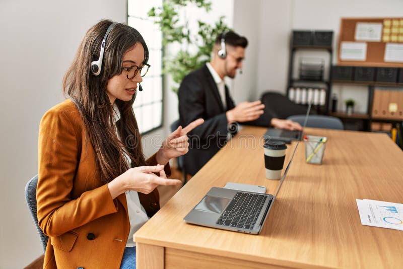 Two Hispanic Call Center Agents Working at the Office Stock Photo ...