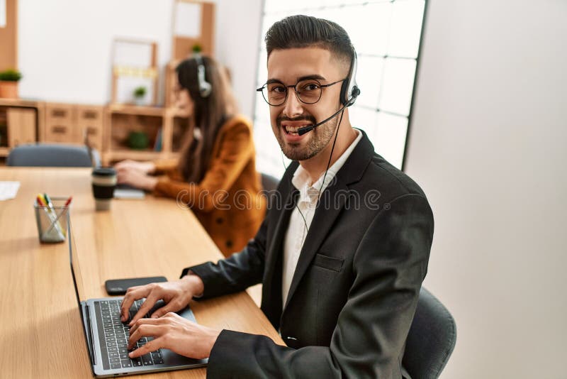 Two Hispanic Call Center Agents Working at the Office Stock Photo ...