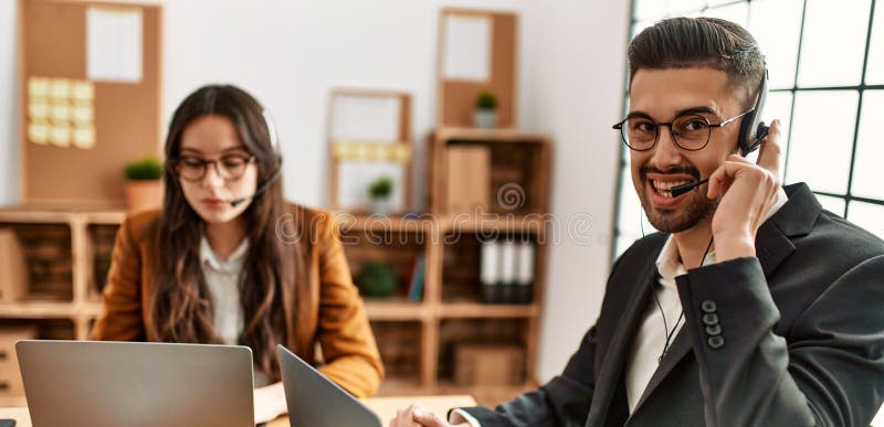 Two Hispanic Call Center Agents Working at the Office Stock Photo ...